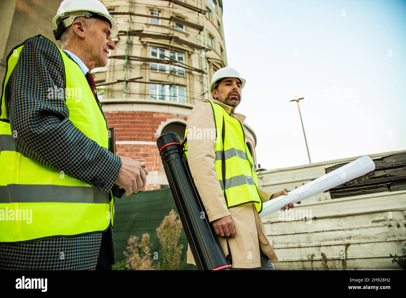 Serious worker construction plans hi-res stock photography and images ...
