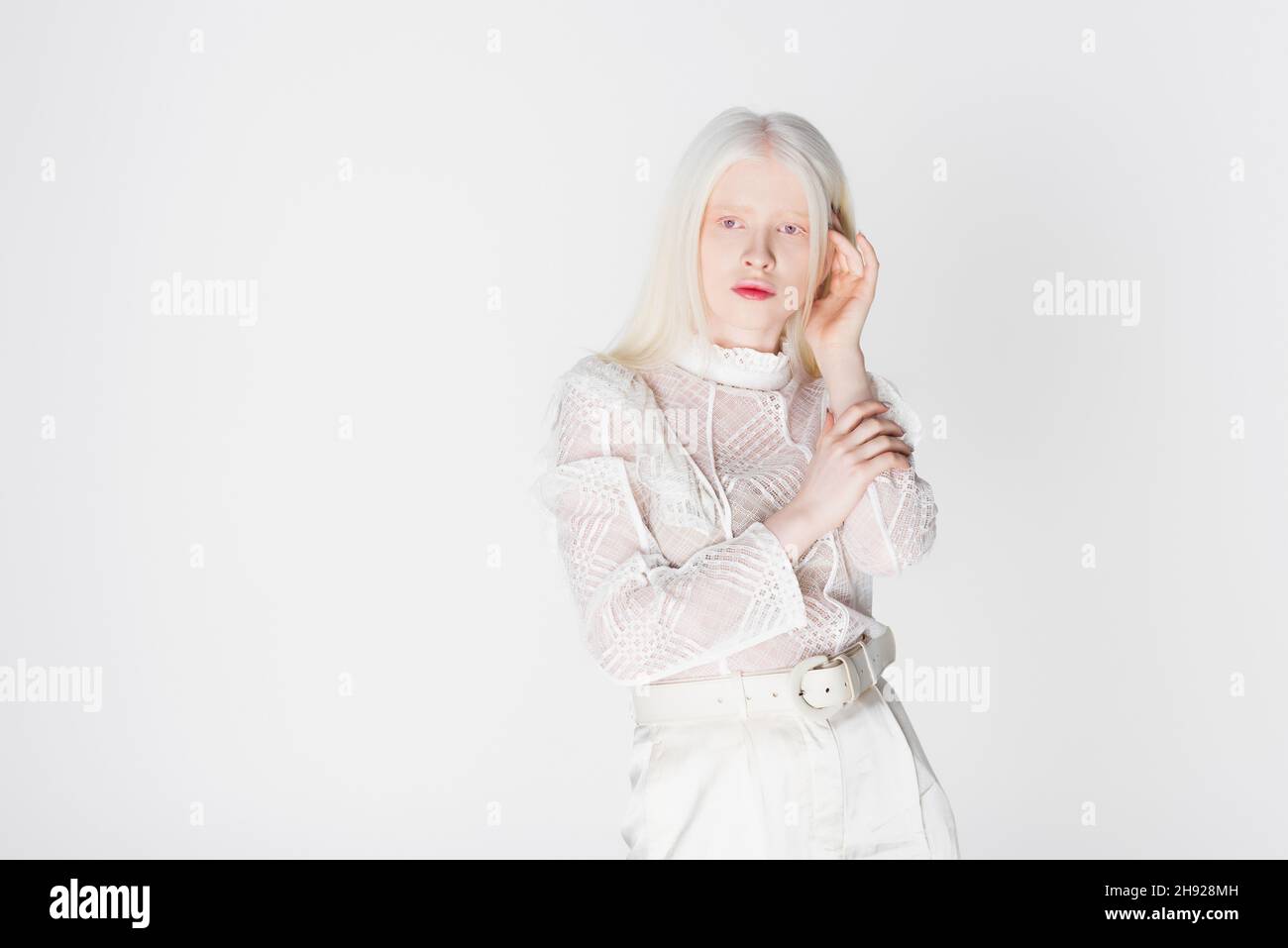 Pretty albino woman looking at camera isolated on white Stock Photo - Alamy
