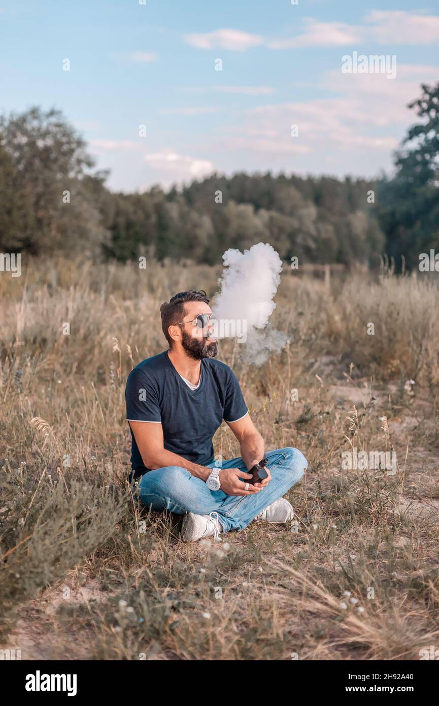 Man smoking in forest addiction hi-res stock photography and images - Alamy