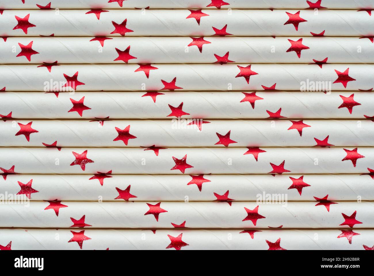 Eco paper recyclable straws pattern. Red stars design. Closeup of ...