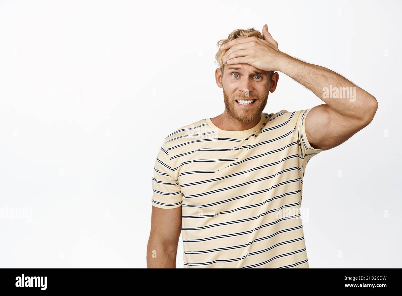 Upset guy slaps forehead and looking guilty, forgot something, remember ...