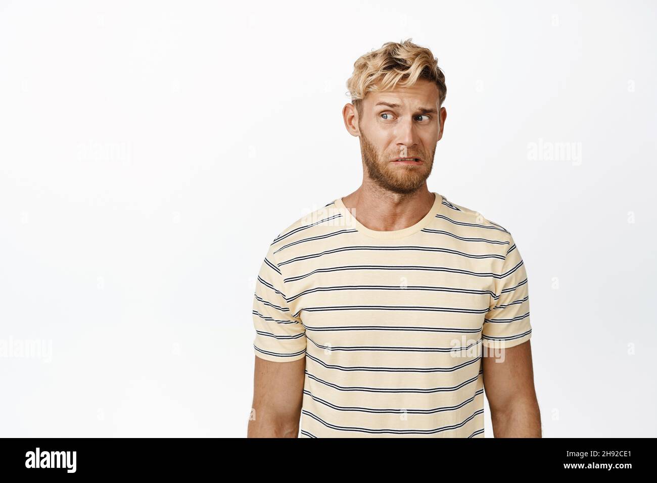 Image of blond adult guy cringe and grimacing from something disgusting ...