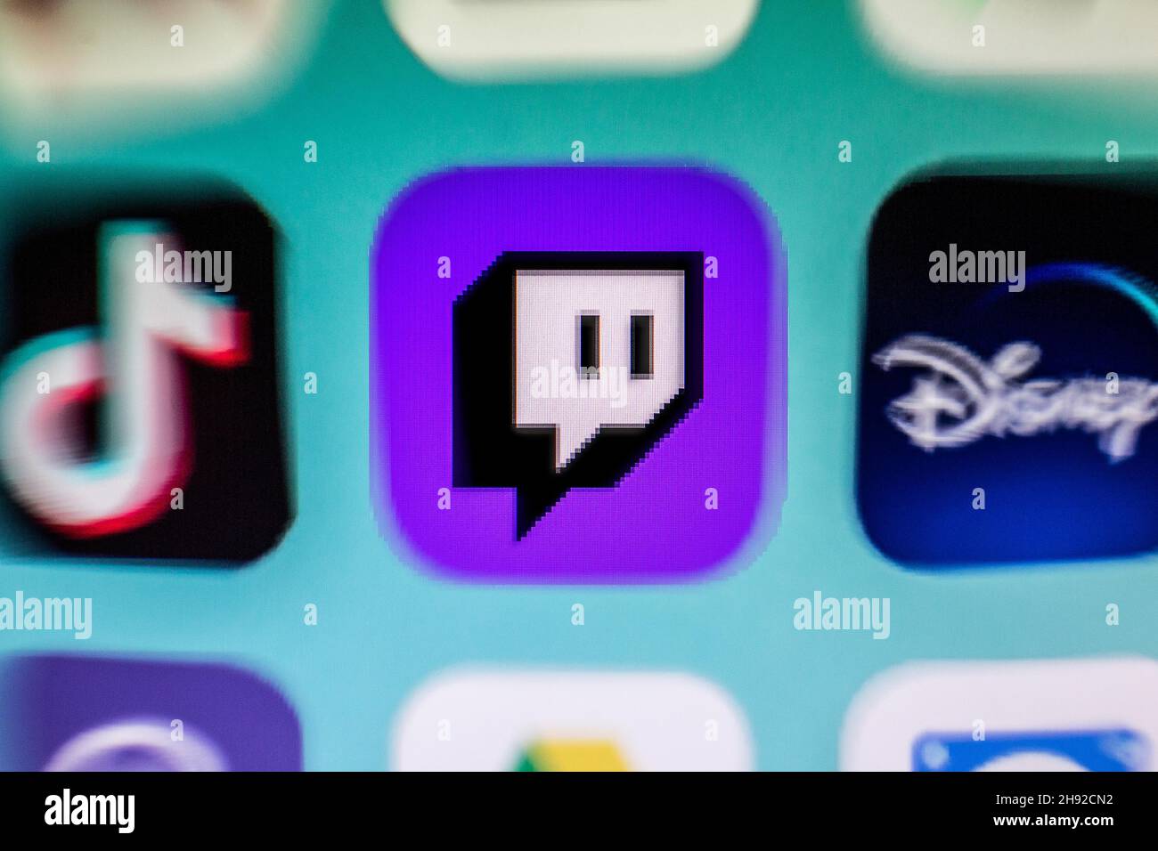 In this photo illustration a close-up of a Twitch app icon seen ...