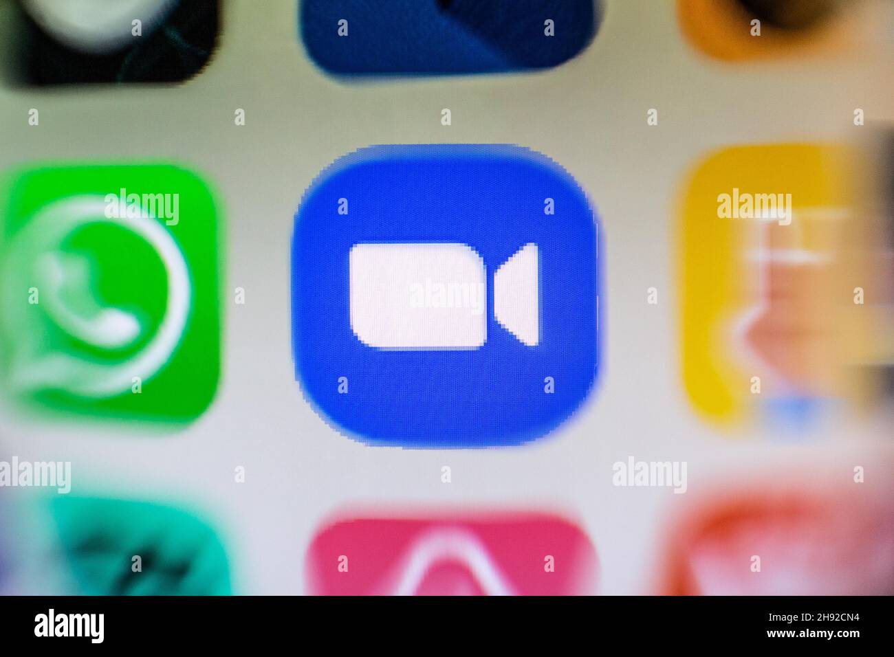 In this photo illustration a close-up of a Zoom Meetings app icon seen ...