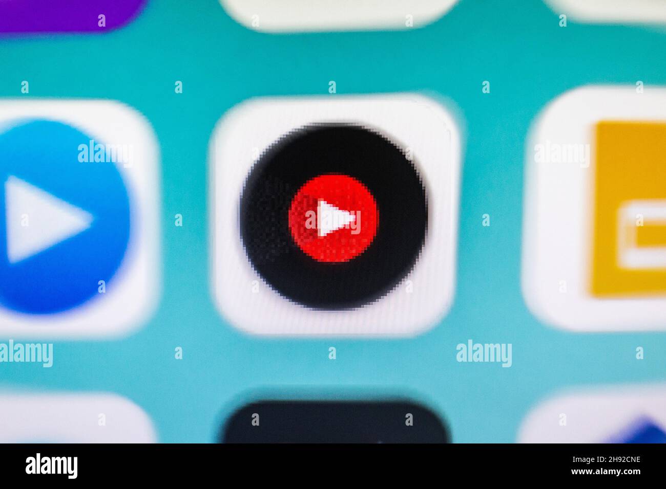 In this photo illustration a close-up of a YouTube Premium app icon ...