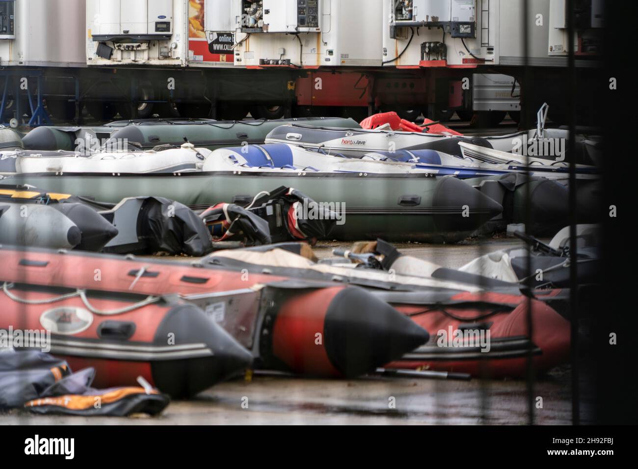 Migrant inflatable boats are seen at the industrial estate near the ...