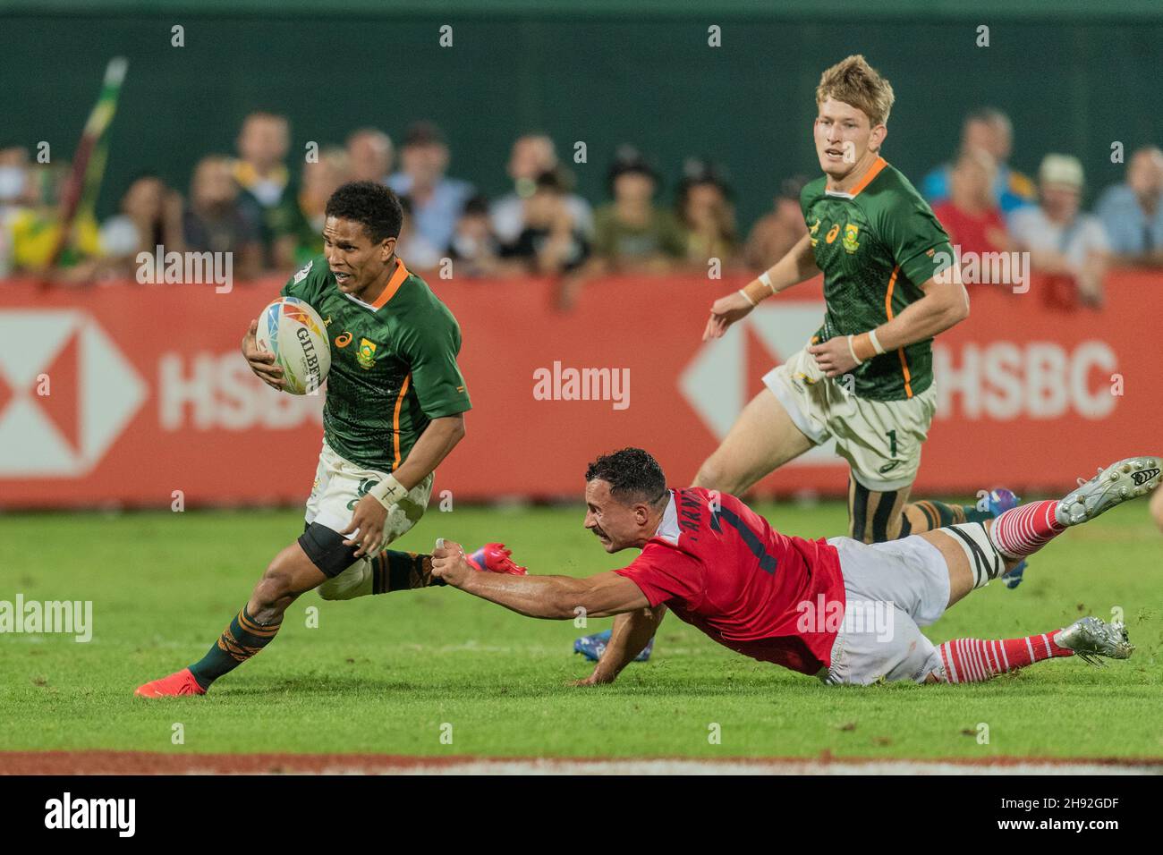 Dubai, UAE. 03rd Dec, 2021. Ronald Brown of South Africa evades the ...