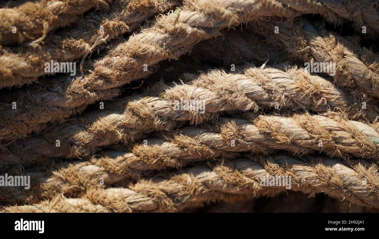 Close-up texture of an old worn out boat rope, rope for mooring boats ...