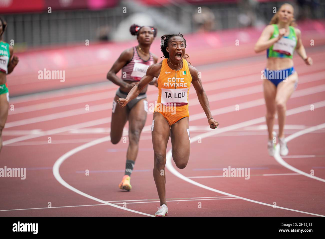 Marie-Josée Ta Lou competing in the 100 meters of the Tokyo 2020 ...