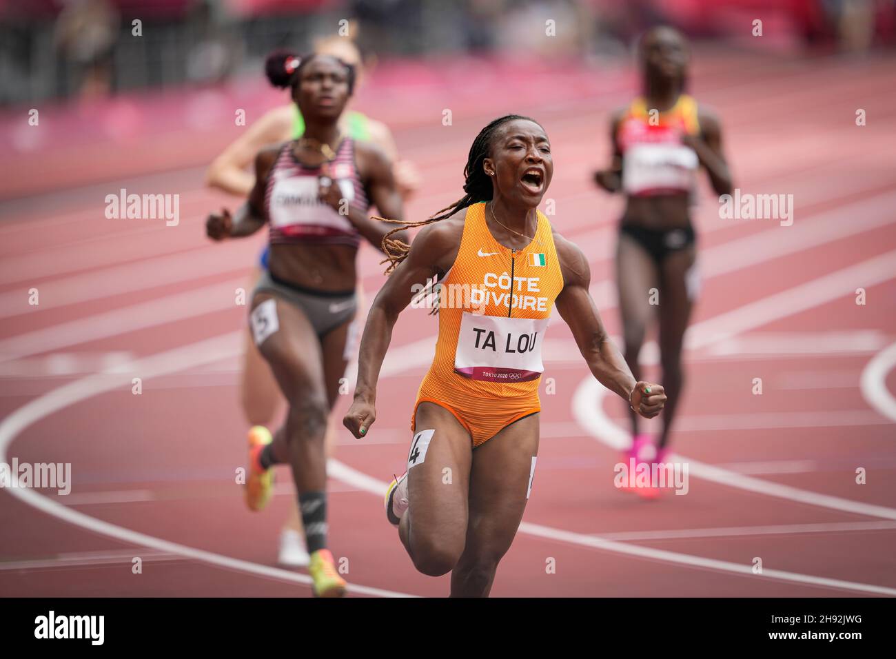 Marie-Josée Ta Lou competing in the 100 meters of the Tokyo 2020 ...