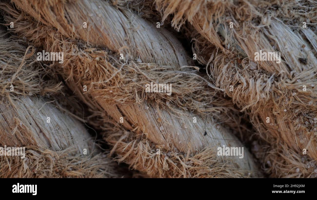 Close-up texture of an old worn out boat rope, rope for mooring boats ...