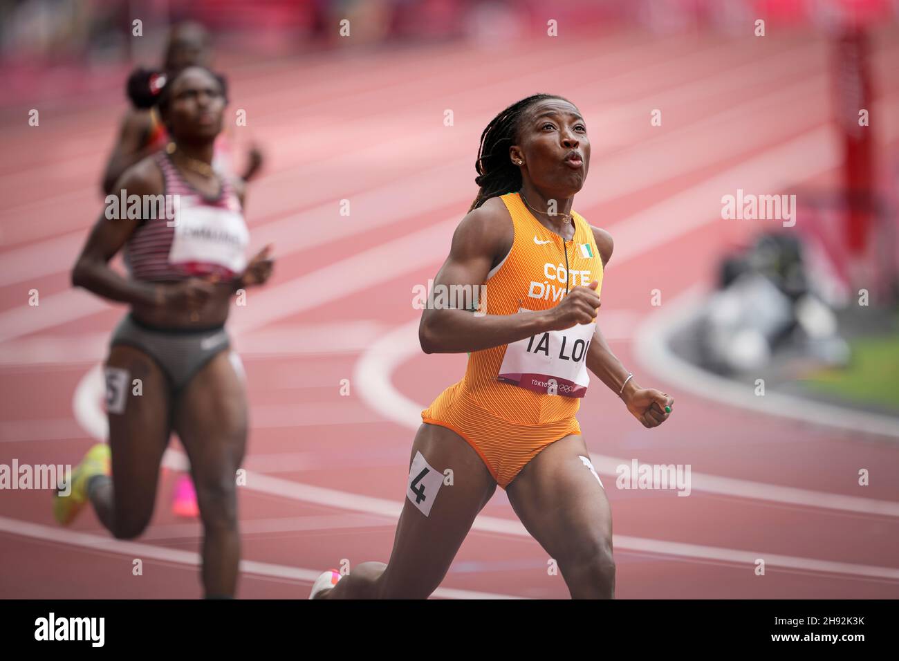 Marie-Josée Ta Lou competing in the 100 meters of the Tokyo 2020 ...