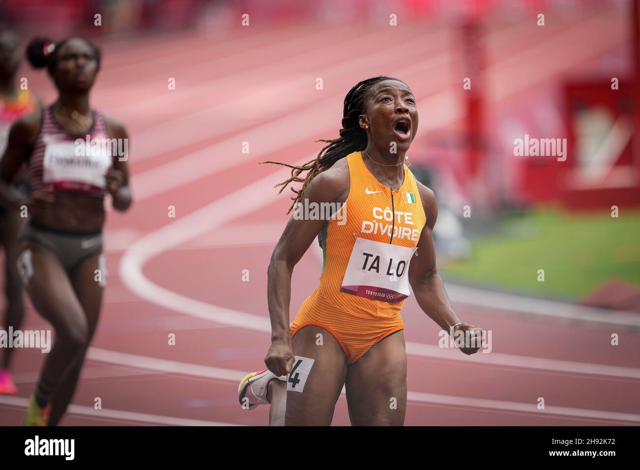 Marie-Josée Ta Lou competing in the 100 meters of the Tokyo 2020 ...