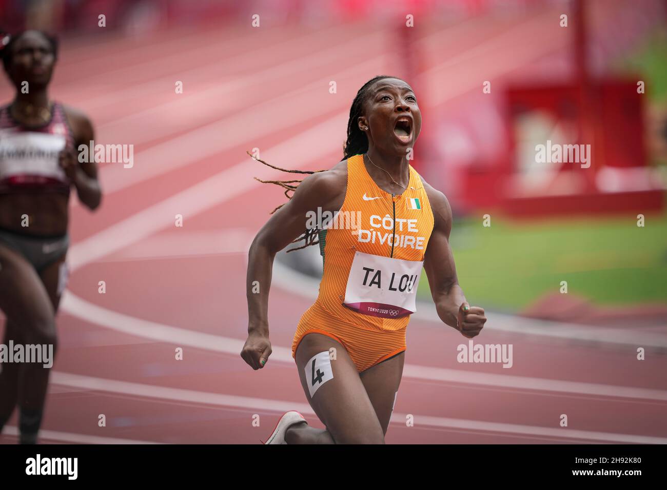 Marie-Josée Ta Lou competing in the 100 meters of the Tokyo 2020 ...
