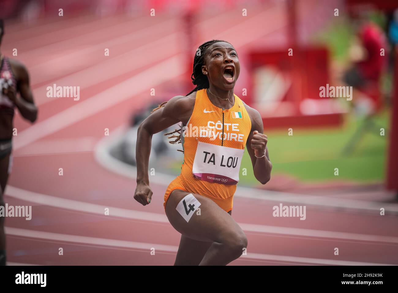 Marie-Josée Ta Lou competing in the 100 meters of the Tokyo 2020 ...