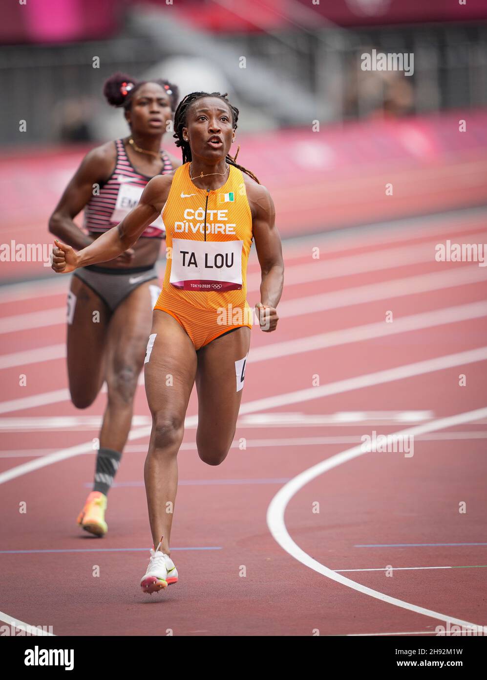 Marie-Josée Ta Lou competing in the 100 meters of the Tokyo 2020 ...