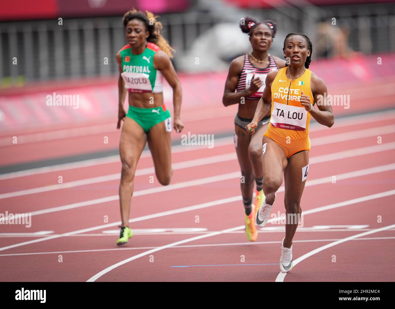 Marie-Josée Ta Lou competing in the 100 meters of the Tokyo 2020 ...