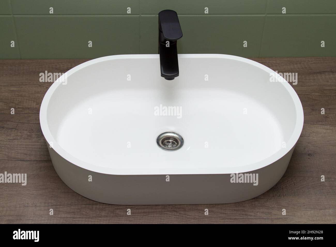 Countertop washbasin with black tap. View from above Stock Photo - Alamy
