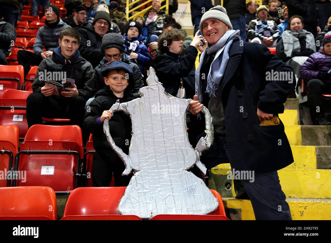Gateshead fans hold up a cardboard FA Cup trophy ahead of the Emirates ...