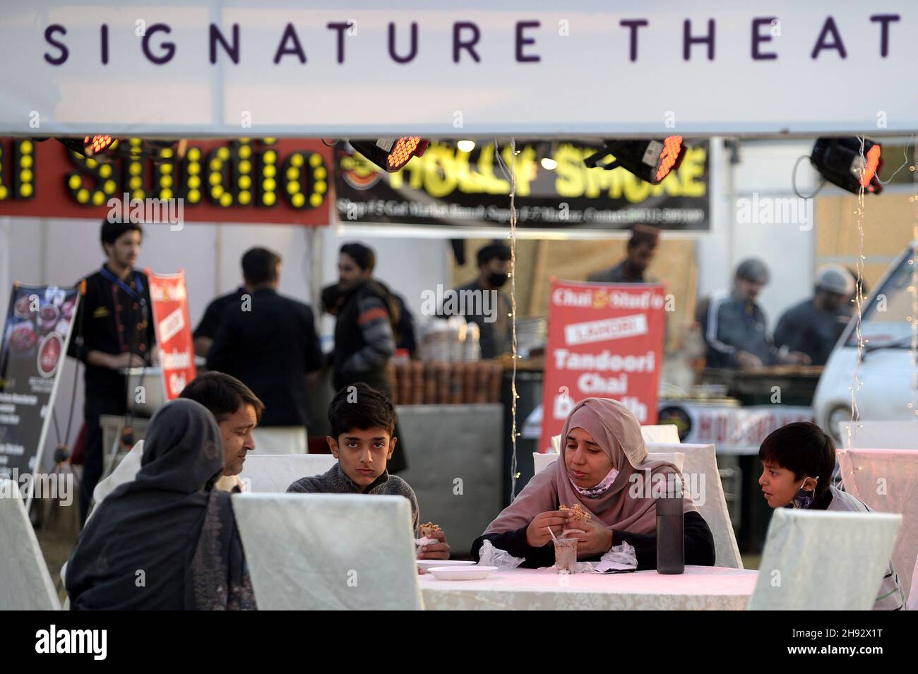 Islamabad, Pakistan. 3rd Dec, 2021. People dine during a food festival ...