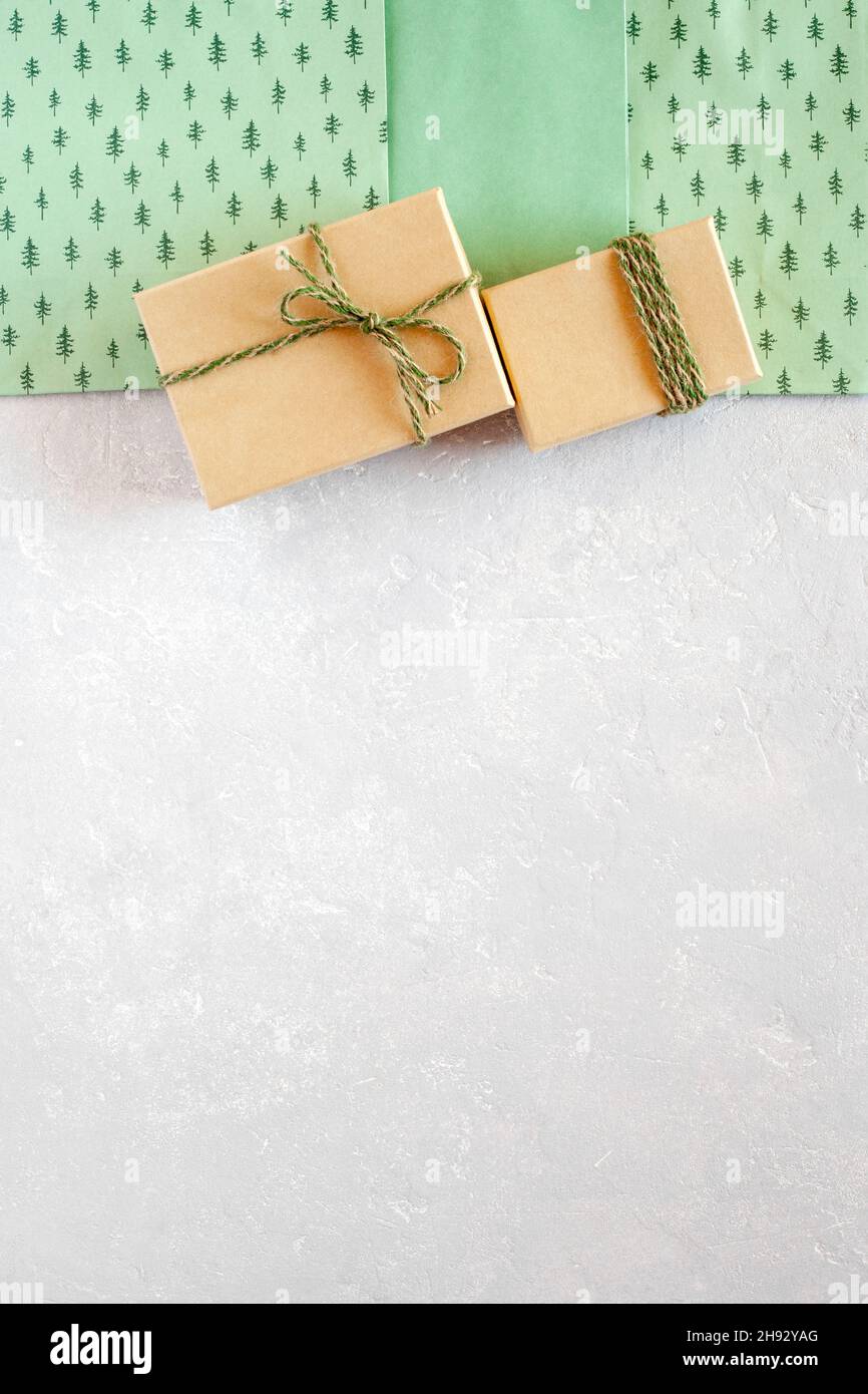 Craft paper gift boxes and green paper gift bags, copy space Stock ...