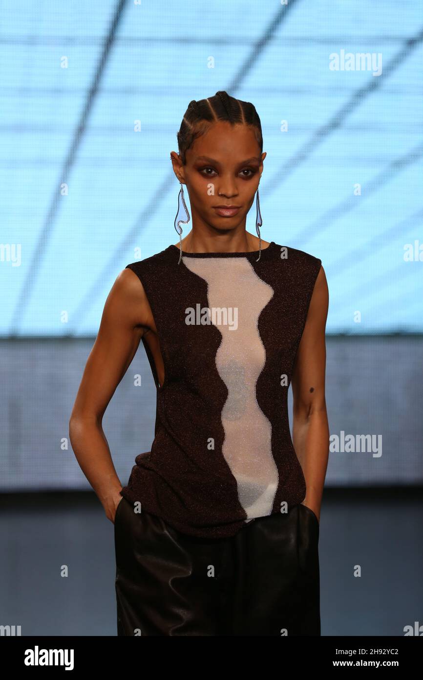 A model walks the runway at the Eftychia Fashion show, during the ...