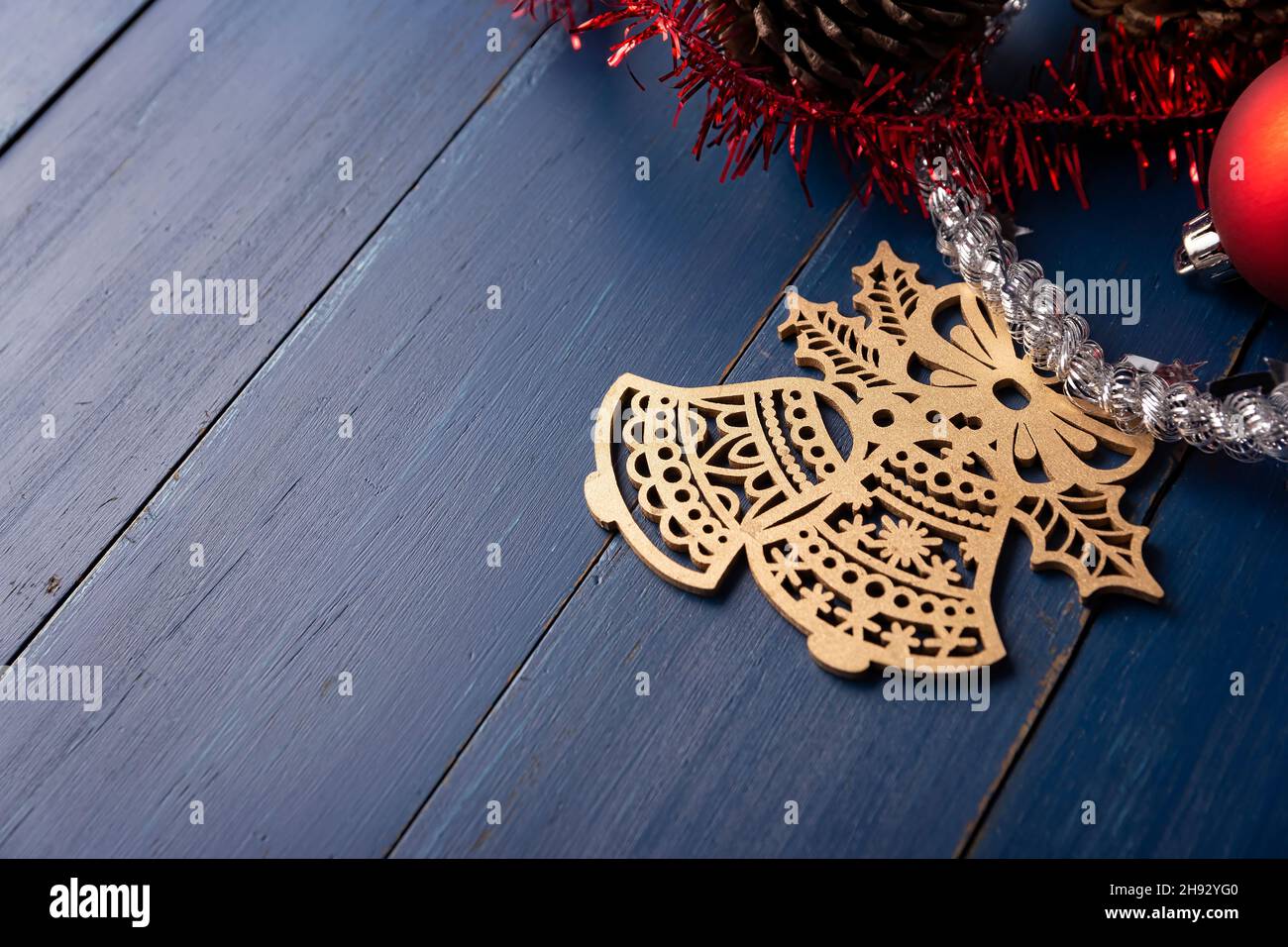 Pine cones and red christmas bells for christmas decoration on vintage ...