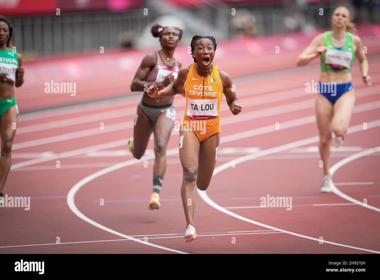 Marie-Josée Ta Lou competing in the 100 meters of the Tokyo 2020 ...