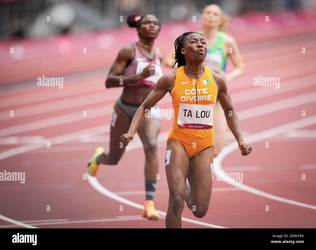 Marie-Josée Ta Lou competing in the 100 meters of the Tokyo 2020 ...