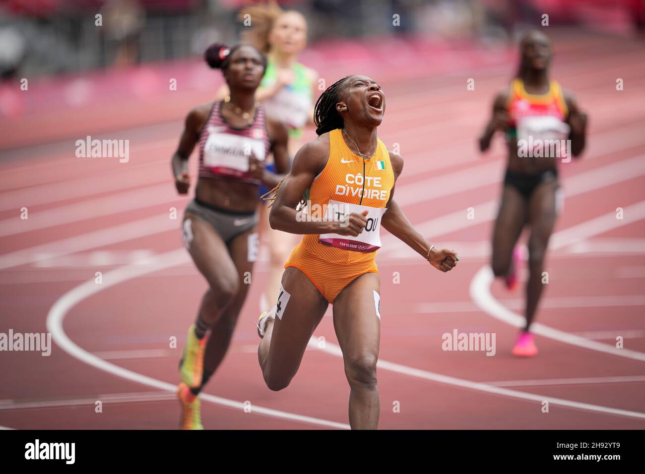 Marie-Josée Ta Lou competing in the 100 meters of the Tokyo 2020 ...