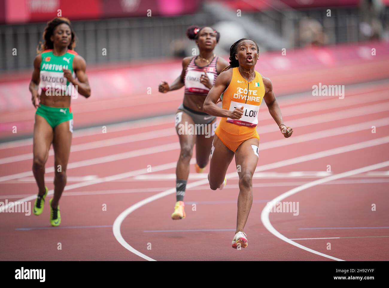Marie-Josée Ta Lou competing in the 100 meters of the Tokyo 2020 ...