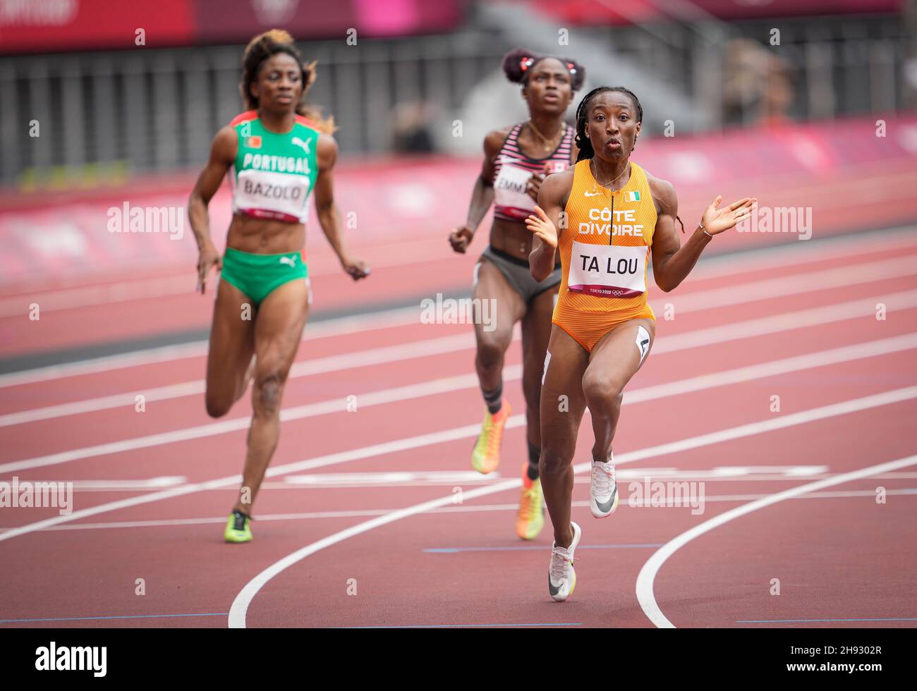 Marie-Josée Ta Lou competing in the 100 meters of the Tokyo 2020 ...