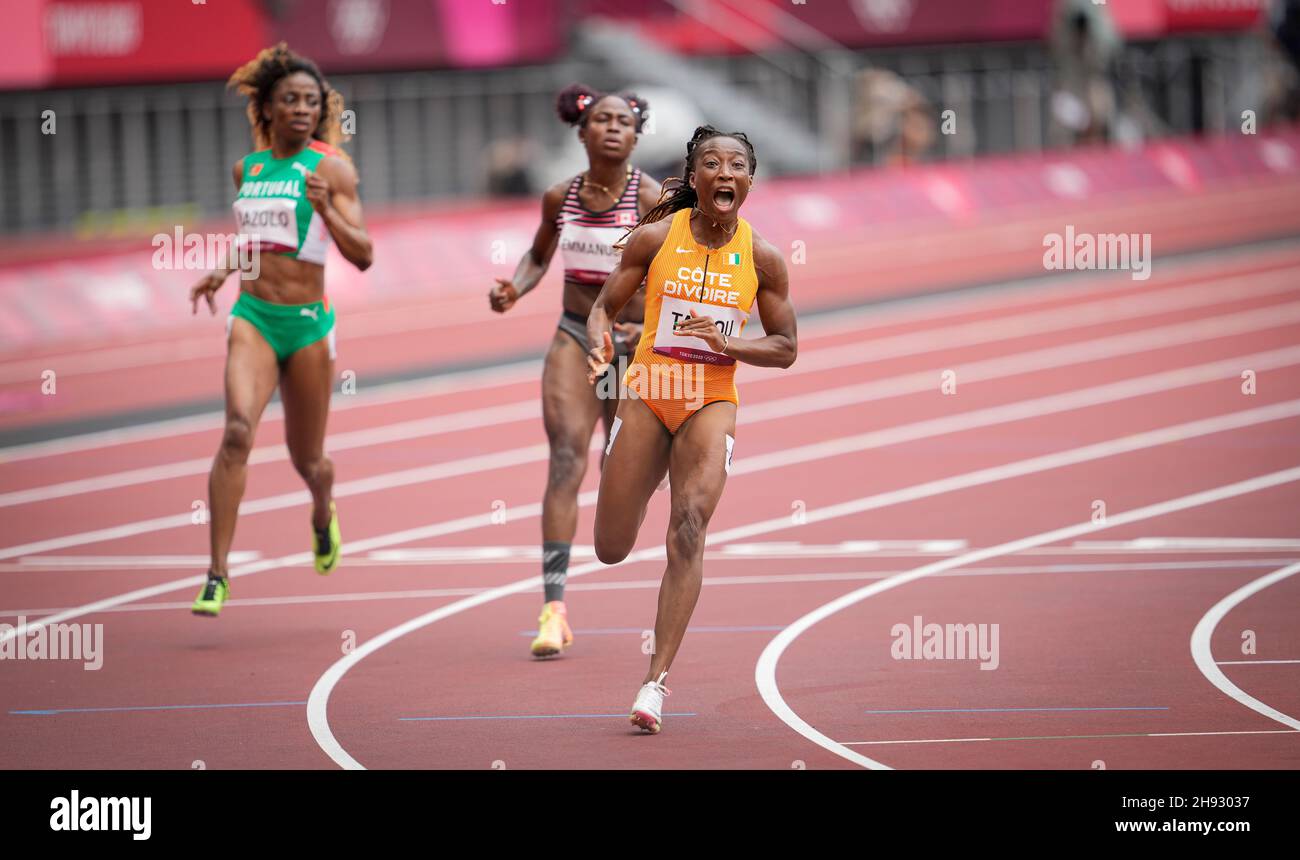 Marie-Josée Ta Lou competing in the 100 meters of the Tokyo 2020 ...