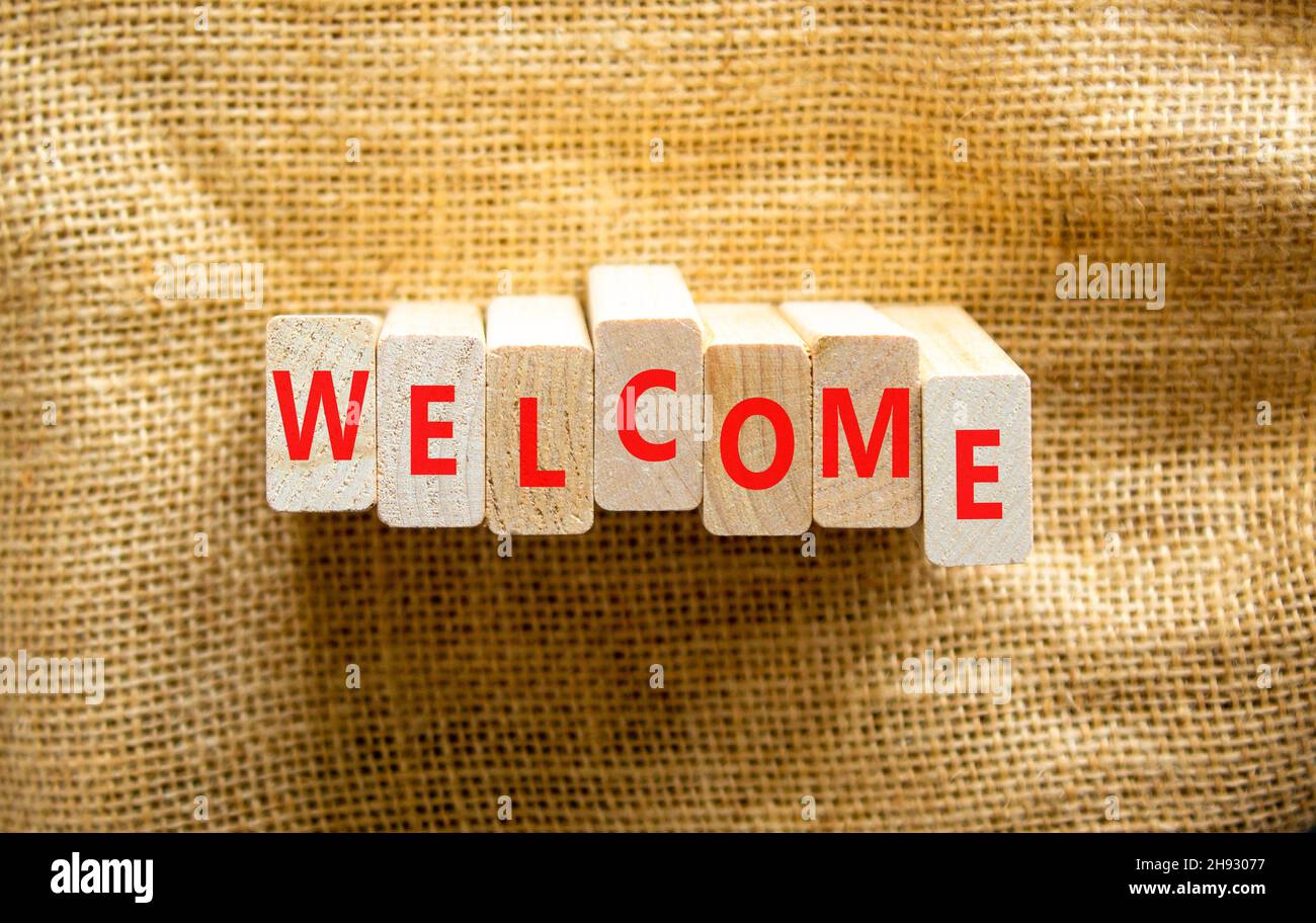 Welcome and support symbol. The concept word Welcome on wooden blocks ...