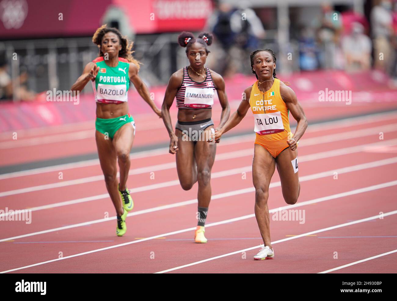 Marie-Josée Ta Lou competing in the 100 meters of the Tokyo 2020 ...