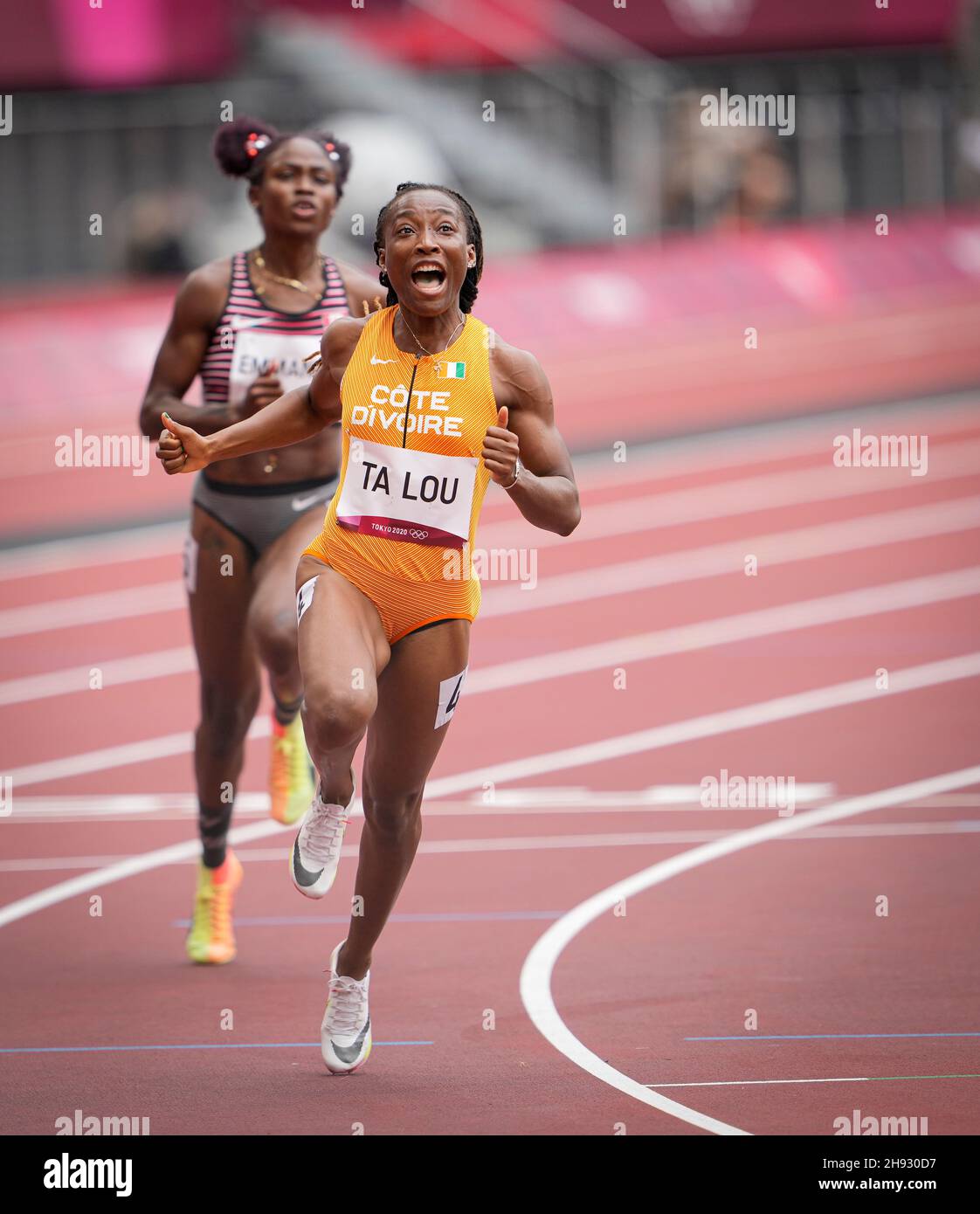 Marie-Josée Ta Lou competing in the 100 meters of the Tokyo 2020 ...