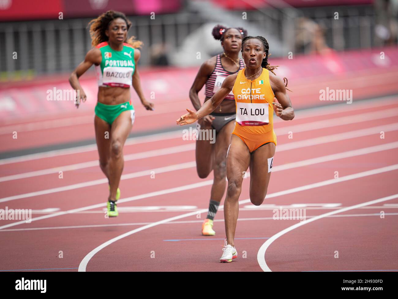 Marie-Josée Ta Lou competing in the 100 meters of the Tokyo 2020 ...