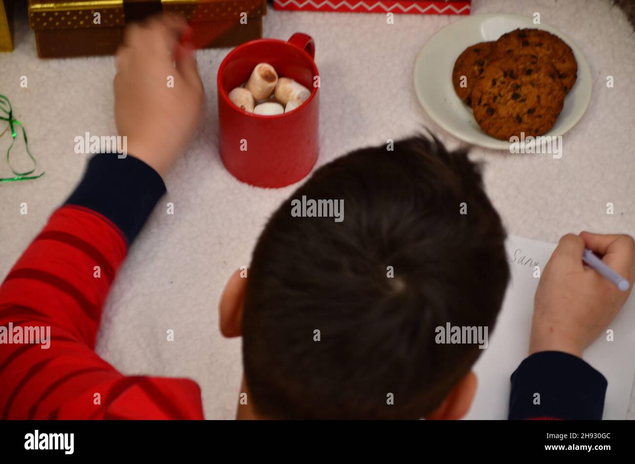 Christmas Child Write Letter to Santa Letter. Kid in Xmas Hat Writing ...