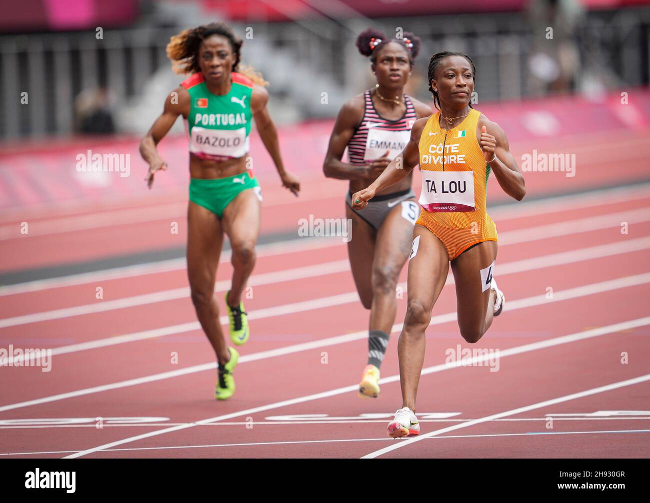 Marie-Josée Ta Lou competing in the 100 meters of the Tokyo 2020 ...