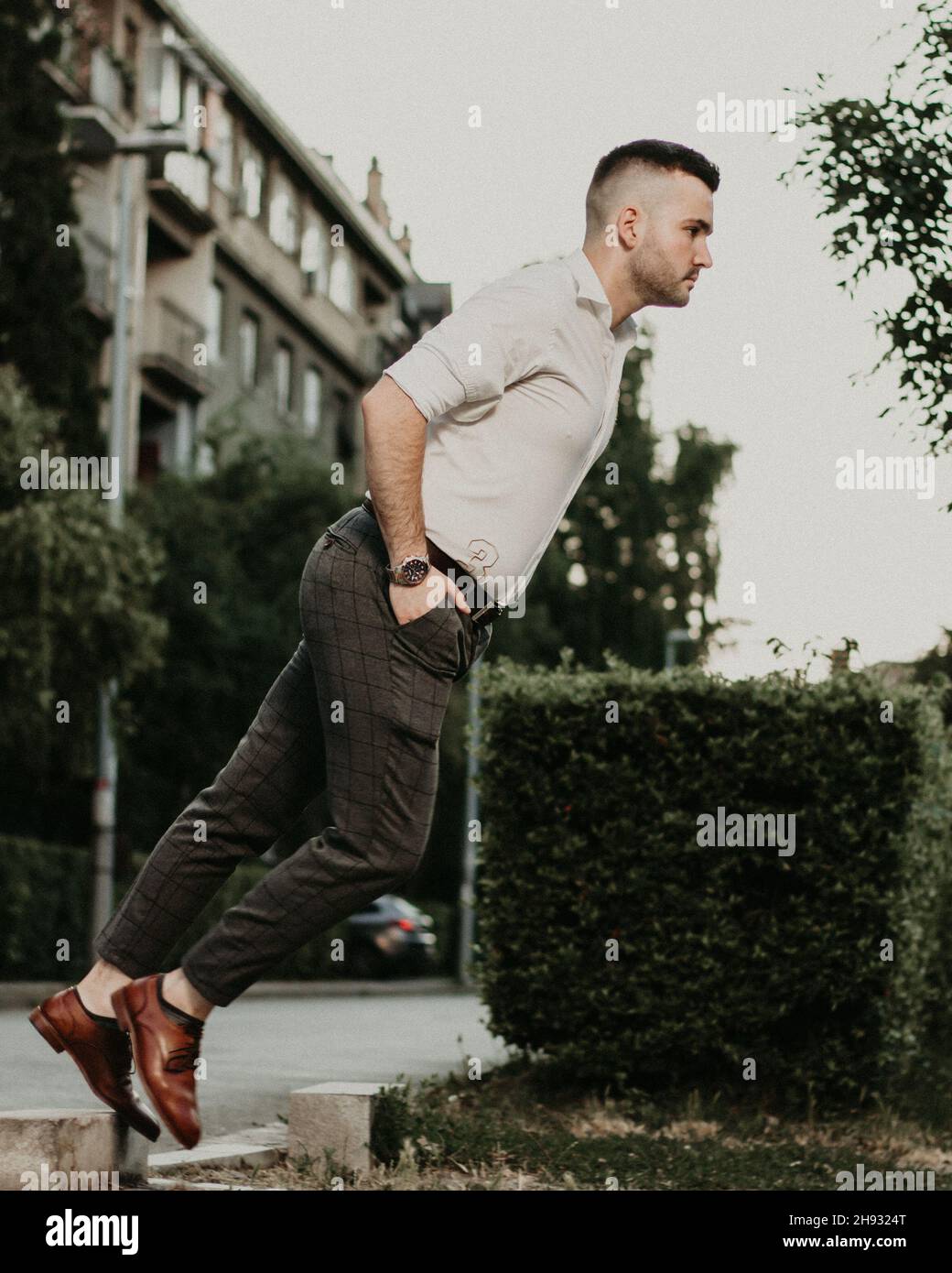Serbian man falling on the ground in the street Stock Photo - Alamy