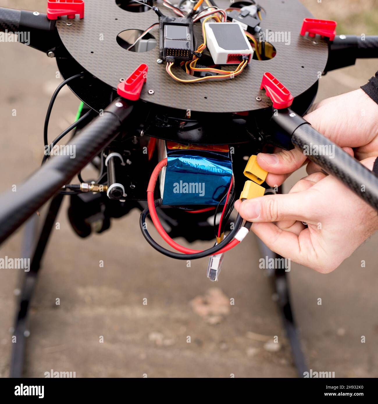 Battery plug drone before taking of. Aerial concept Stock Photo - Alamy