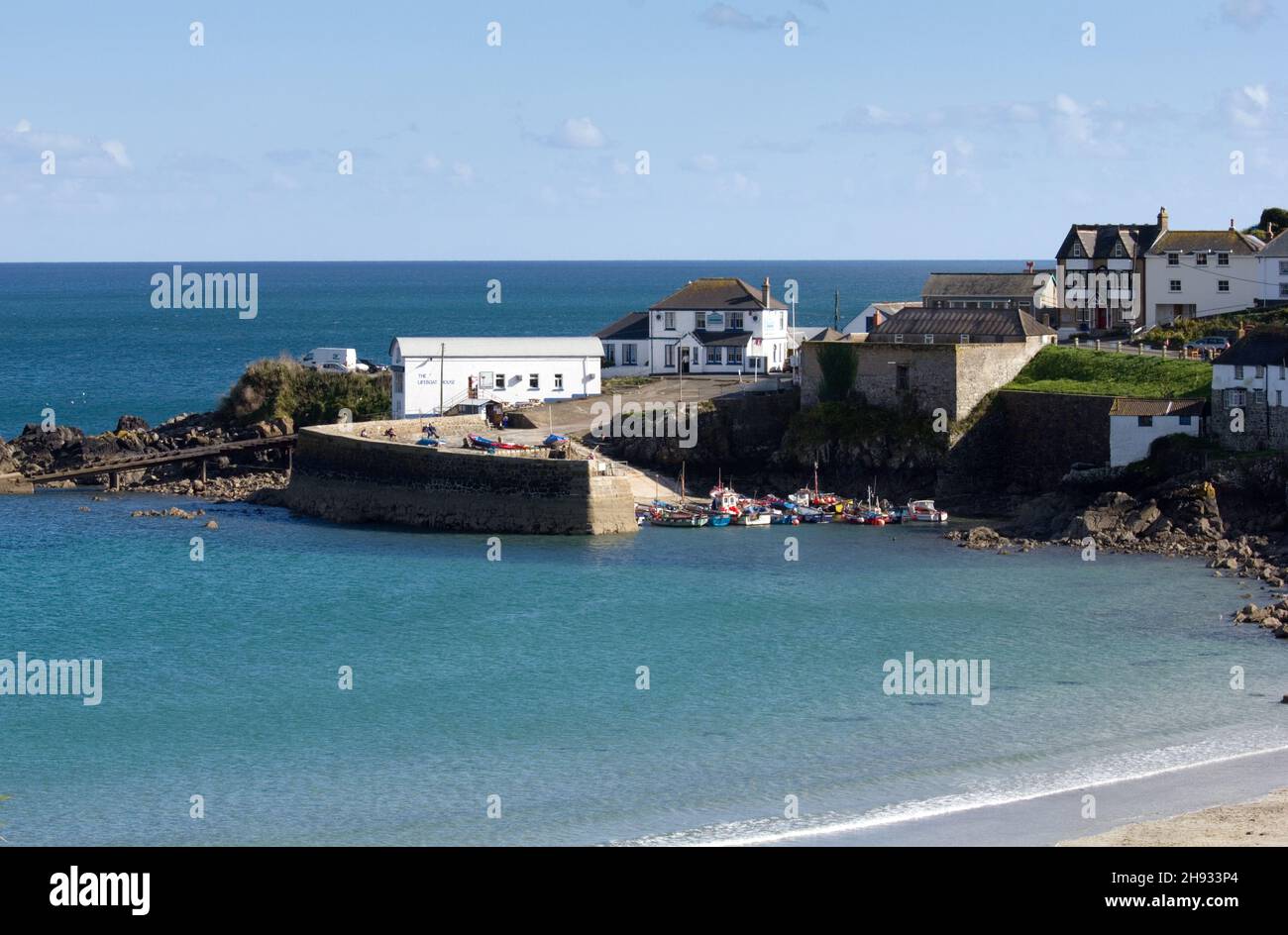 The old Coverack lifeboat station, Coverack harbour, the Paris Inn and ...