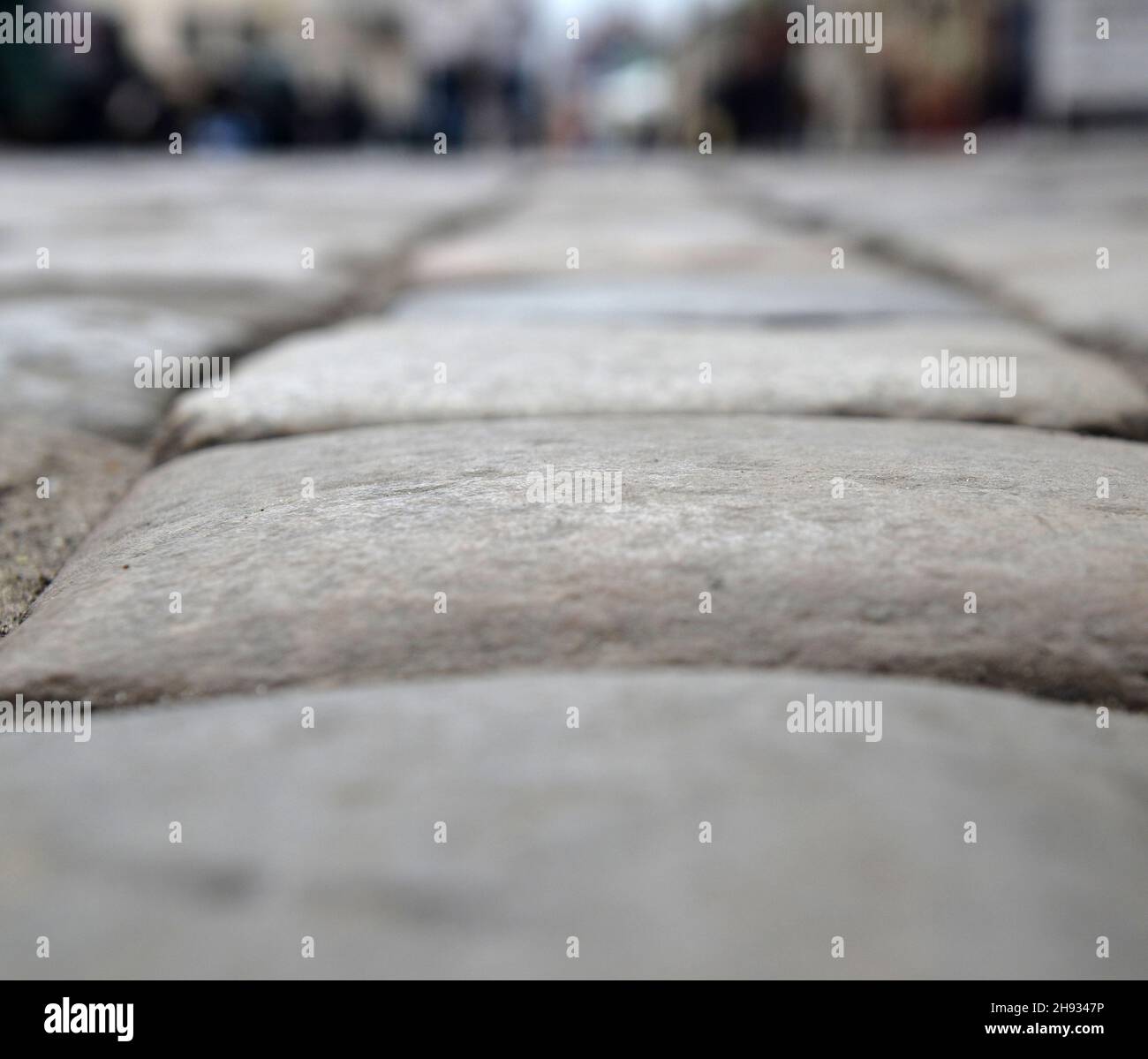 Stones of road pavement close view background Stock Photo - Alamy