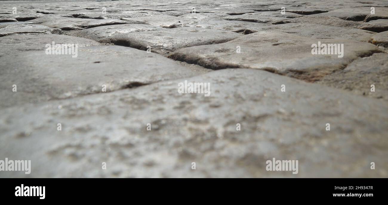 Old stones road pavement, close view background Stock Photo - Alamy