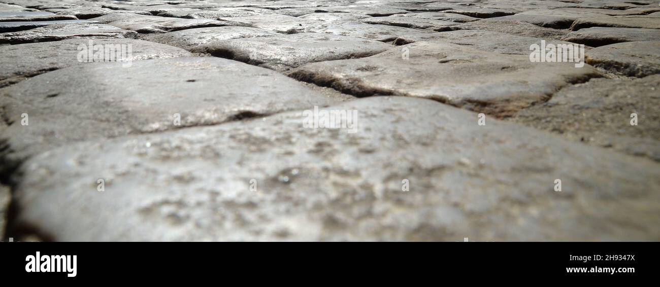 Stone pavement of the road, close view background Stock Photo - Alamy
