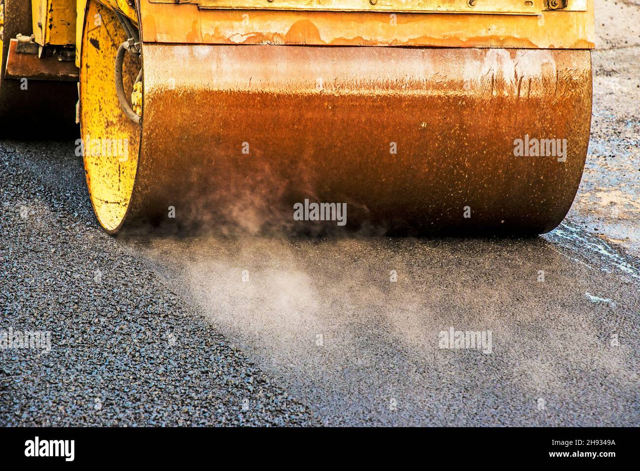 Compact steamroller flatten out the asphalt. Heavy Vibration roller at ...