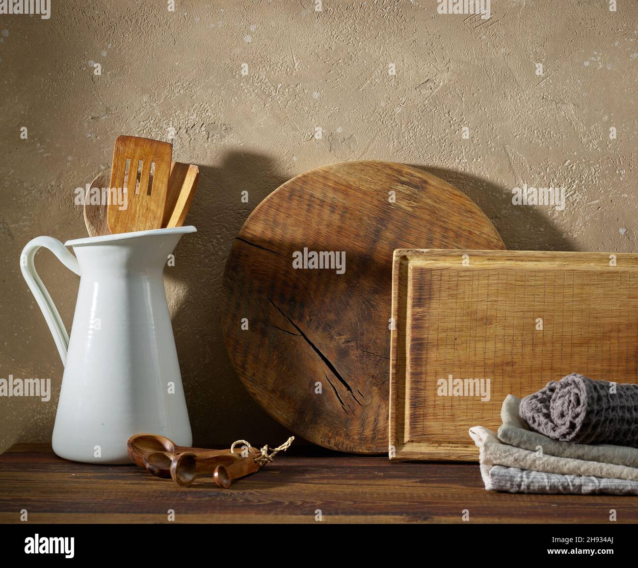 various kitchen tools on brown wooden table Stock Photo - Alamy