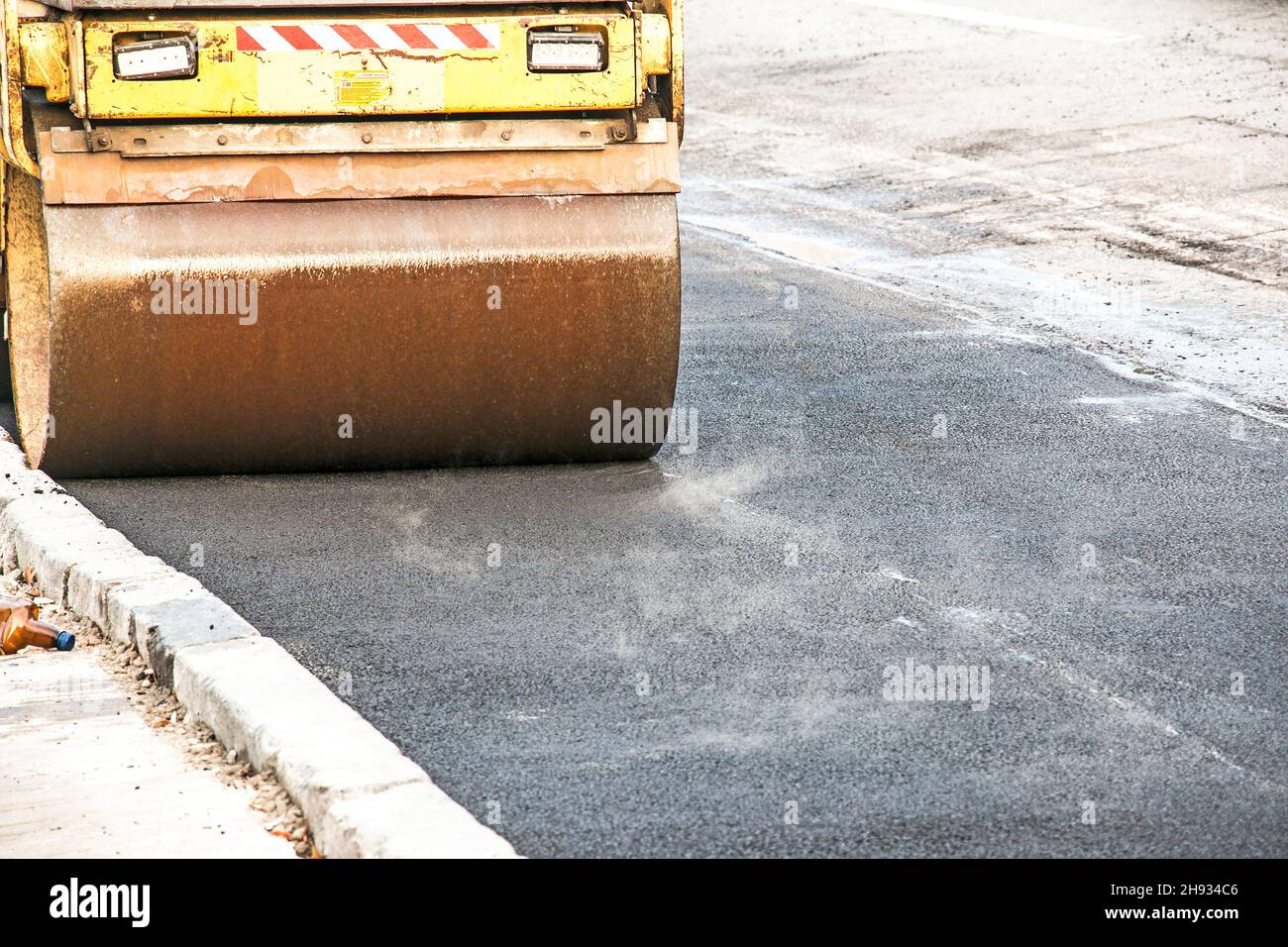 Compact steamroller flatten out the asphalt. Heavy Vibration roller at ...
