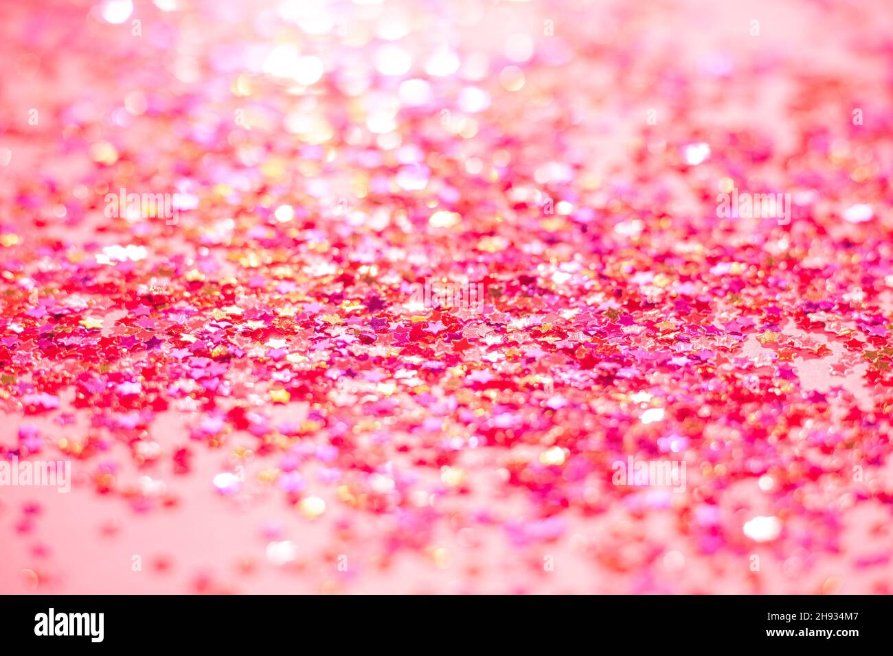 Pink color confetti textured background Stock Photo - Alamy