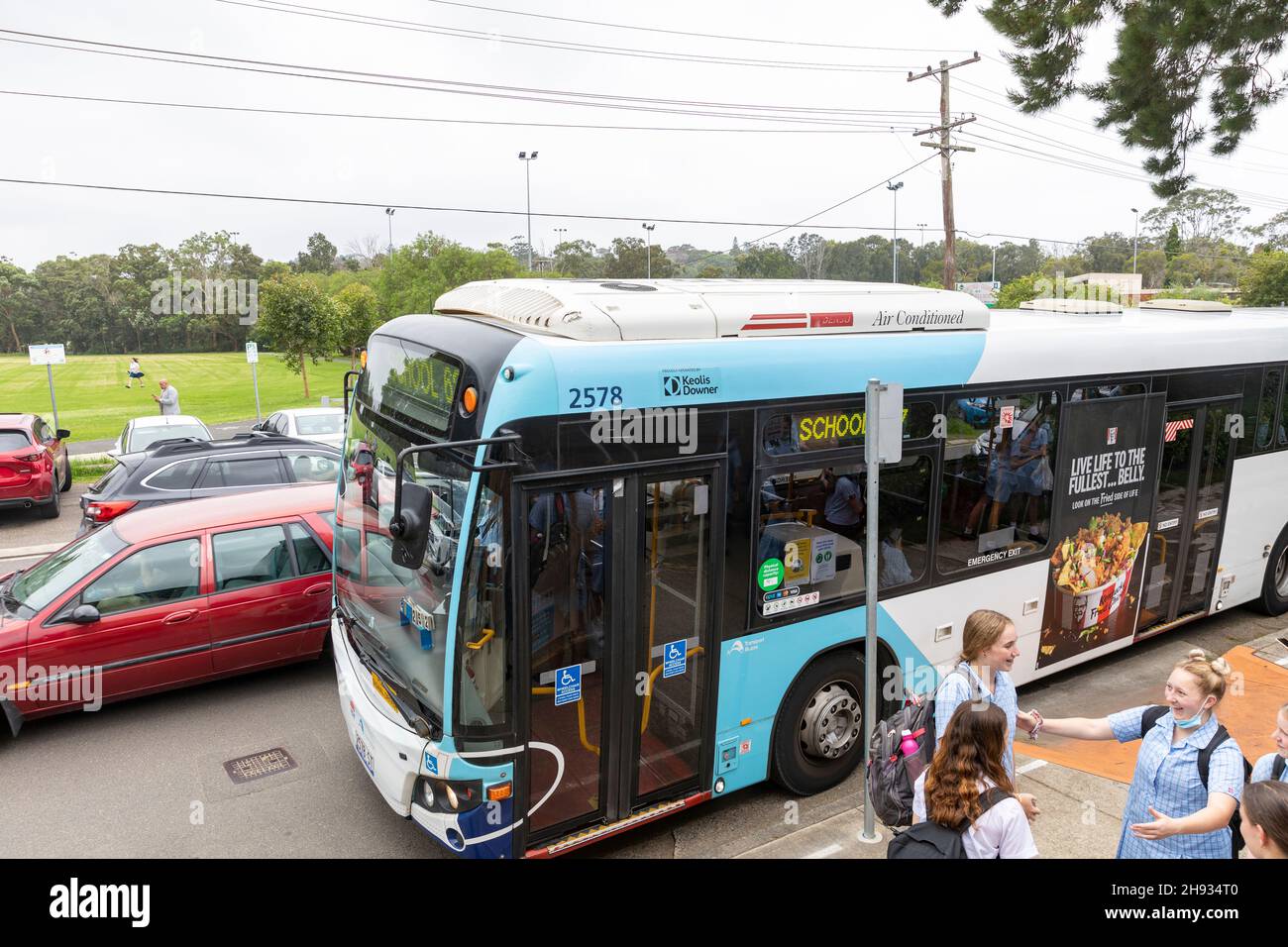 Girl students at a Sydney secondary school wait for their school bus at ...
